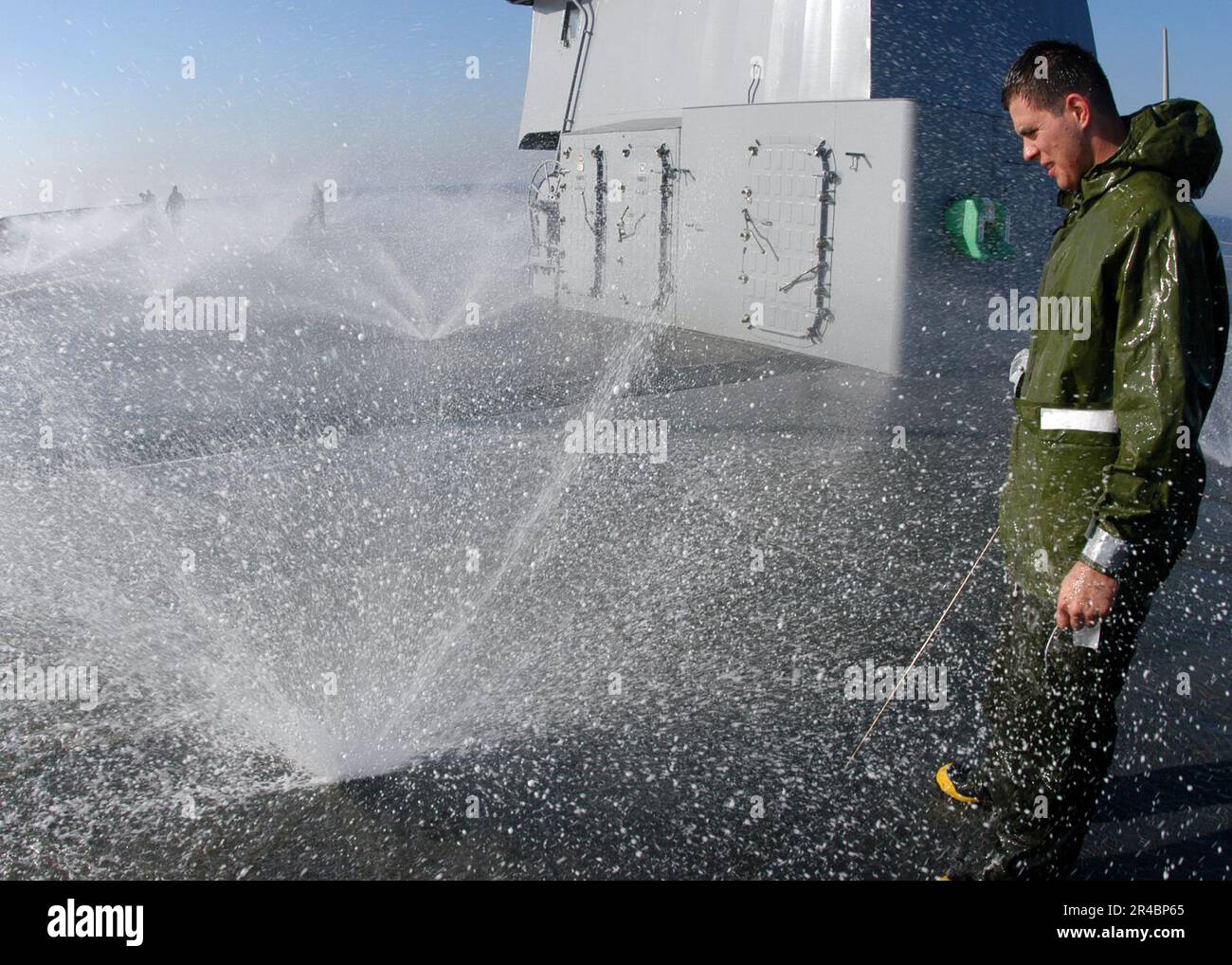 US Navy Damage Controlman 3rd Class Hejl verifies the effectiveness of ...