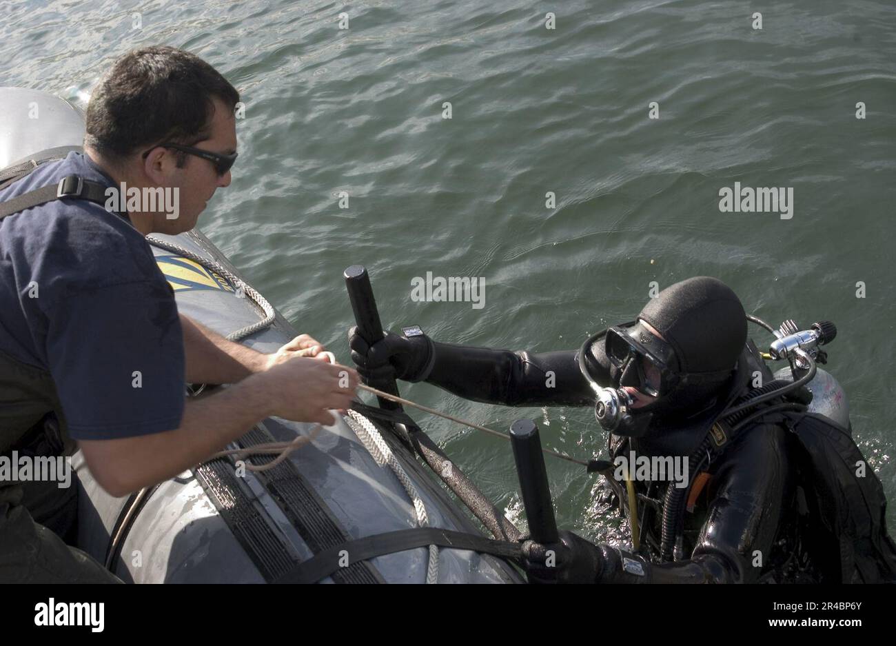 US Navy U.S. Navy Gunner's Mate 1st Class left, assigned to Explosive ...