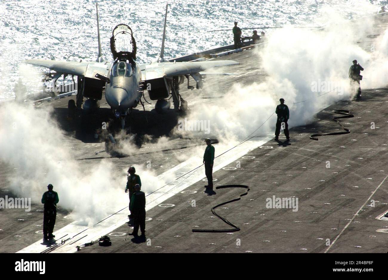 US Navy Air Department personnel run no-load tests on a catapult aboard ...
