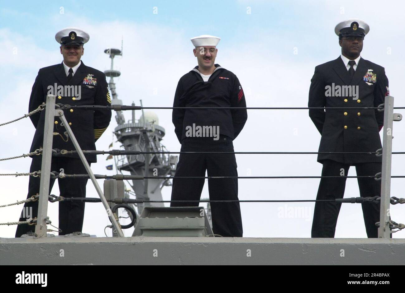US Navy Sailors man the rails of the guided-missile destroyer USS ...