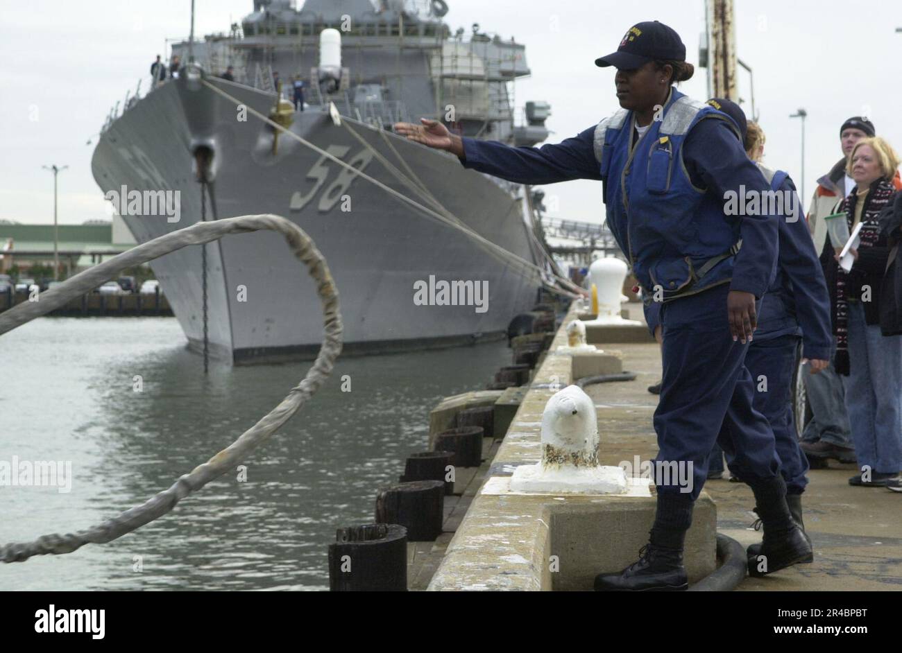 US Navy Ship's Serviceman Petty Officer 3rd Class casts off the line as ...