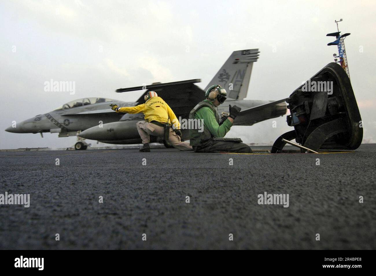 US Navy A catapult shooter gives the signal to launch an F-A-18F Super ...
