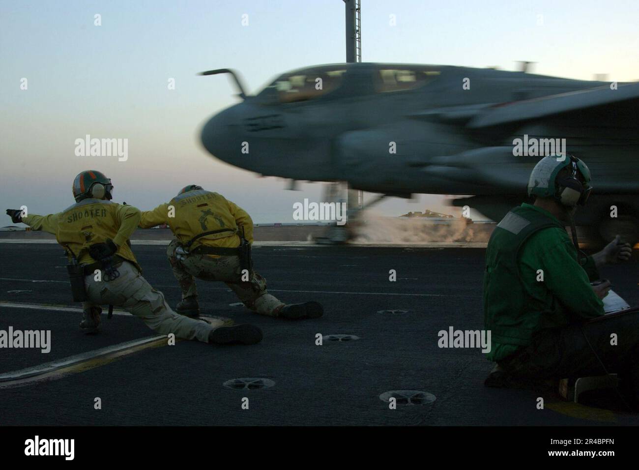 US Navy Catapult shooters Lt. Cmdr. give the signal to launch an EA-6B ...