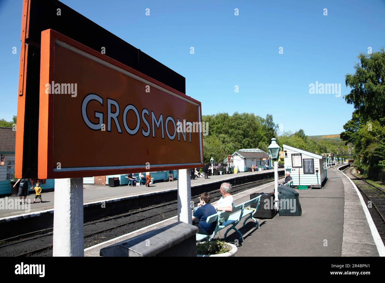 A busy train station platform filled with travelers Stock Photo - Alamy