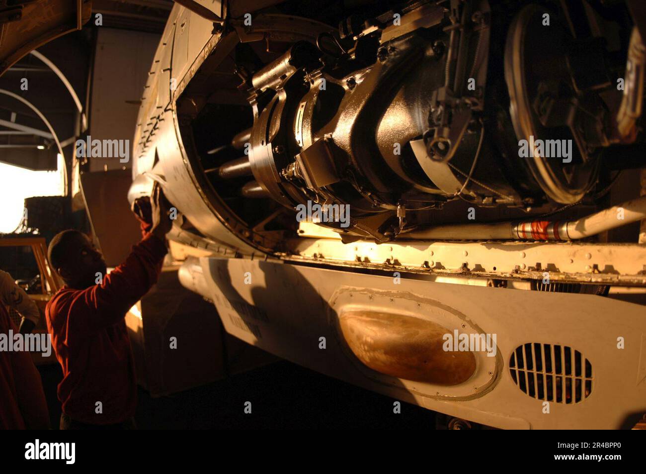 US Navy Aviation Ordnanceman Airman Recruit replaces the access panels ...