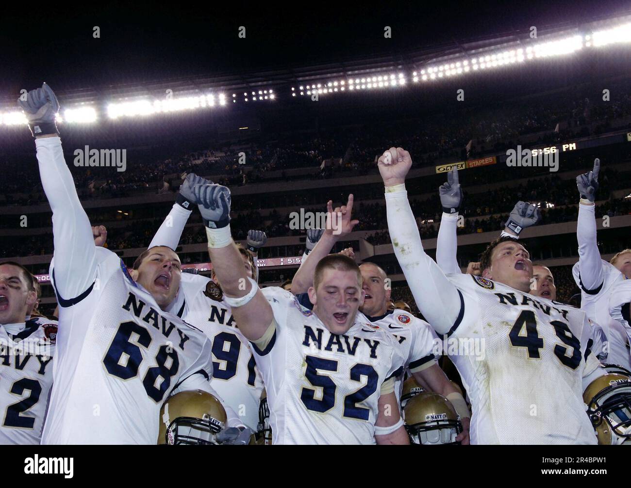 US Navy U.S. Naval Academy Midshipmen celebrate at the conclusion of ...