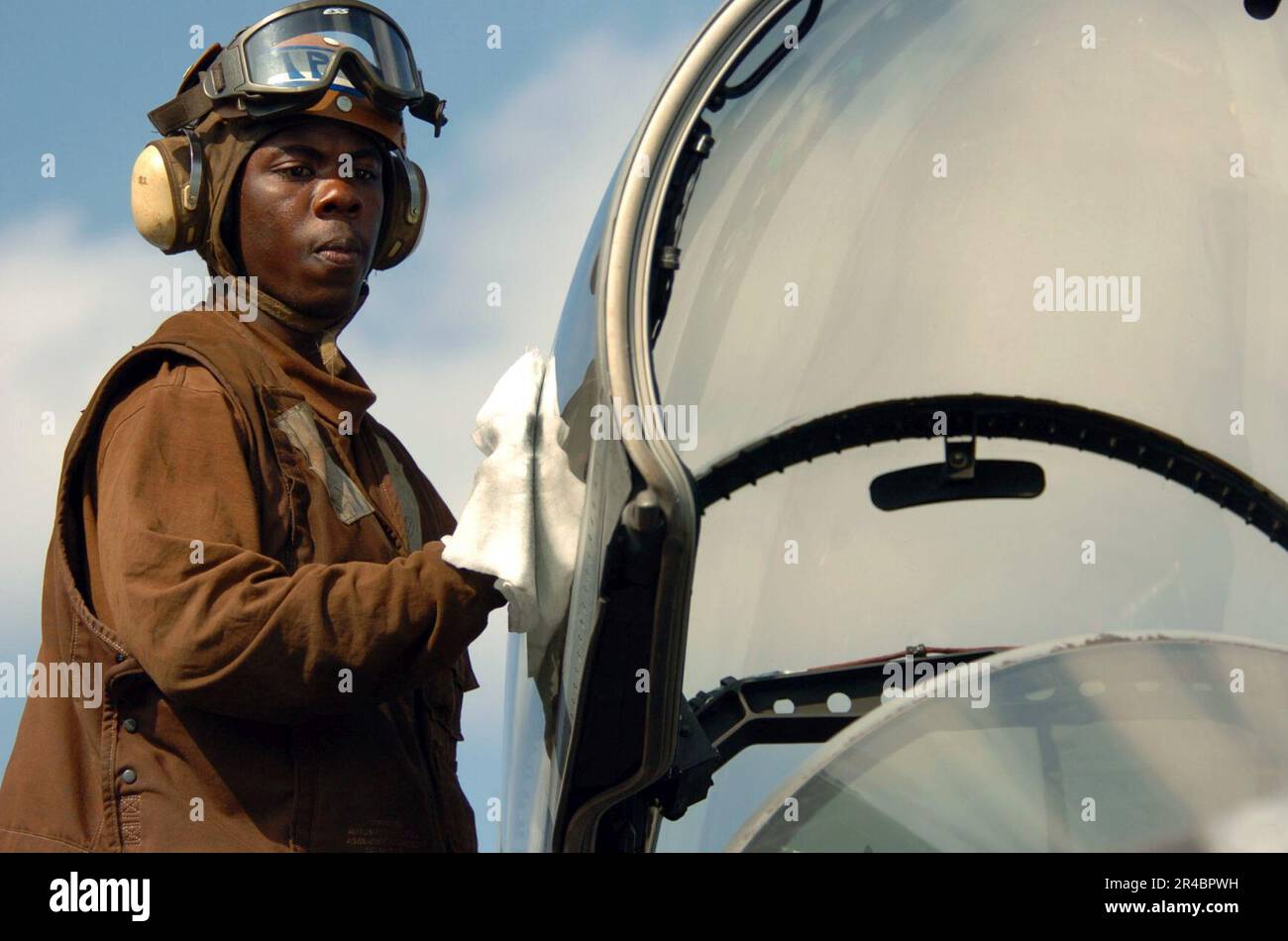 US Navy A plane captain assigned to the Diamondbacks of Strike Fighter ...