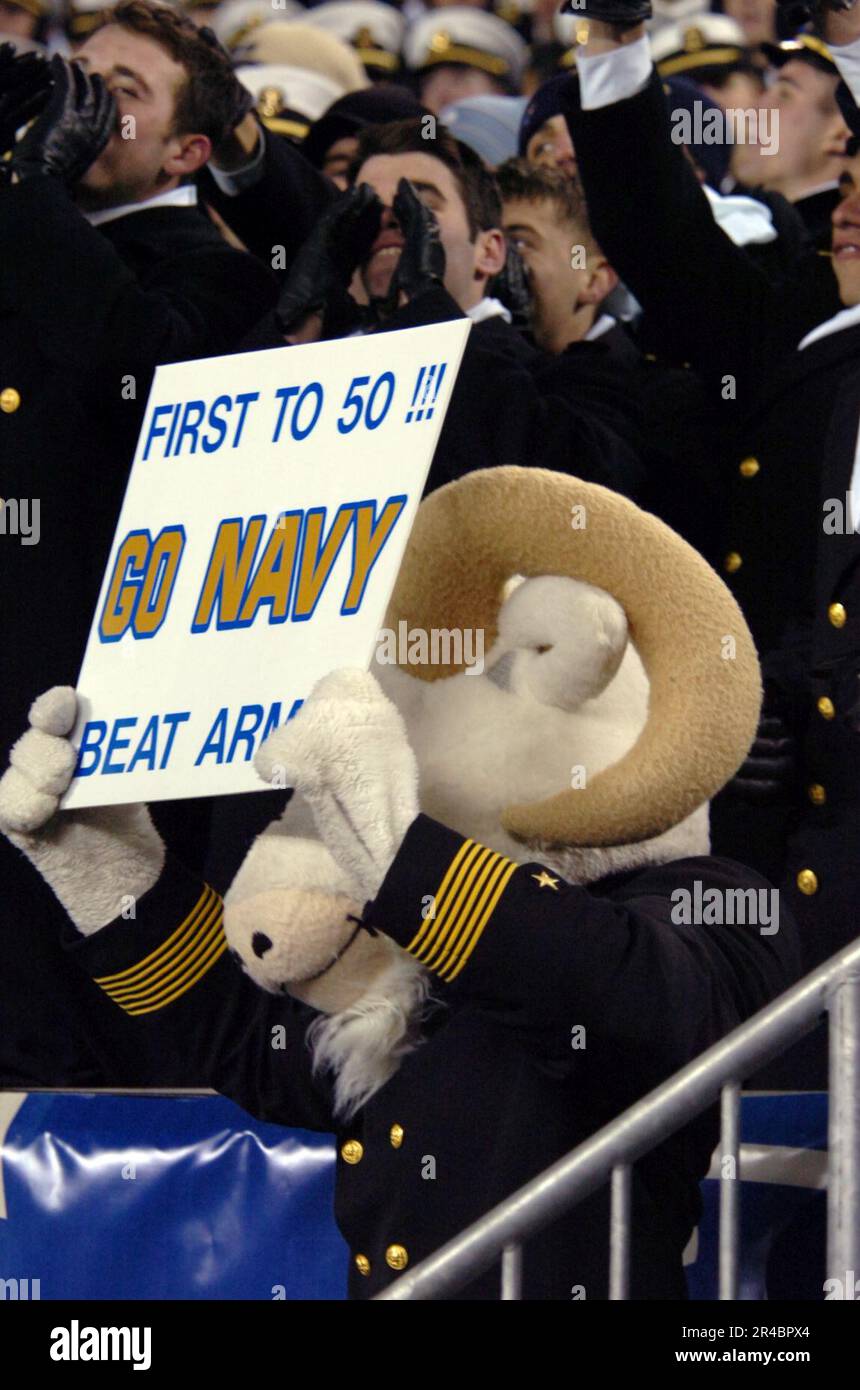 US Navy U.S. Naval Academy mascot Bill the Goat holds up a sign ...