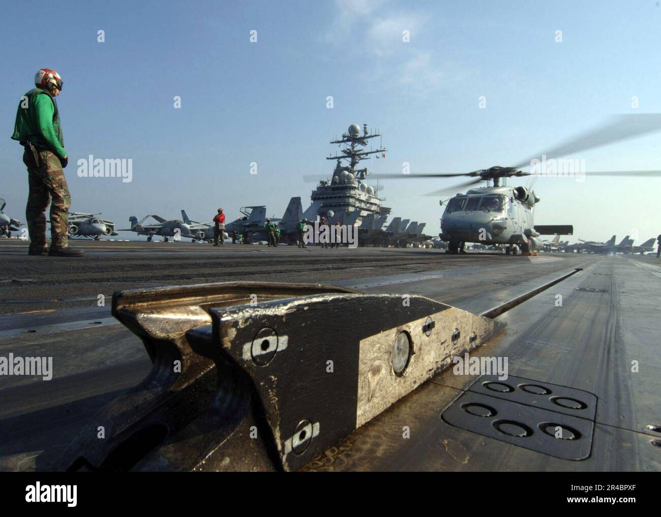 US Navy An SH-60F Seahawk helicopter prepares to lift off from the ...