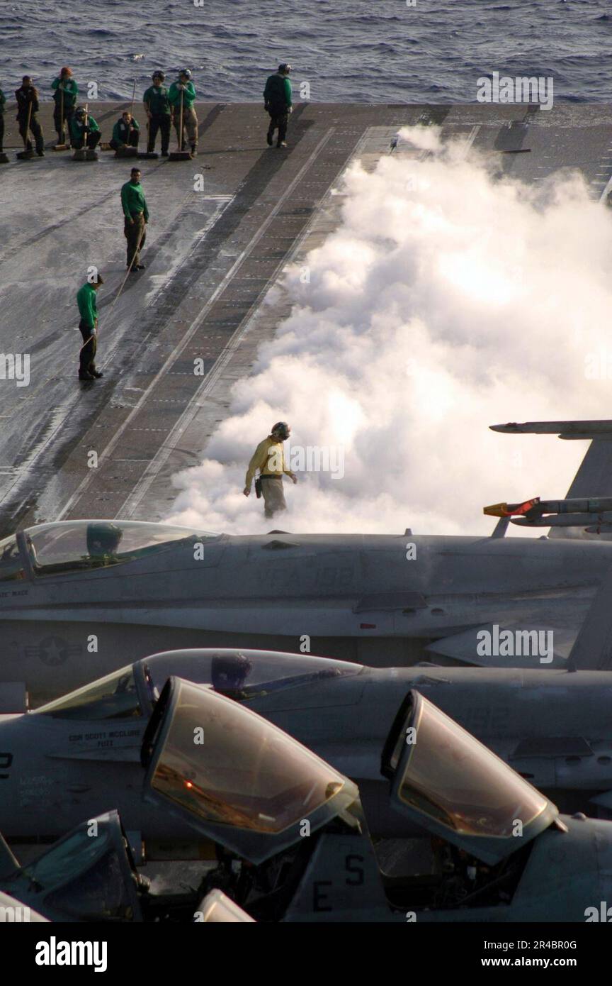 US Navy A cloud of steam engulfs the flight deck of the conventionally ...