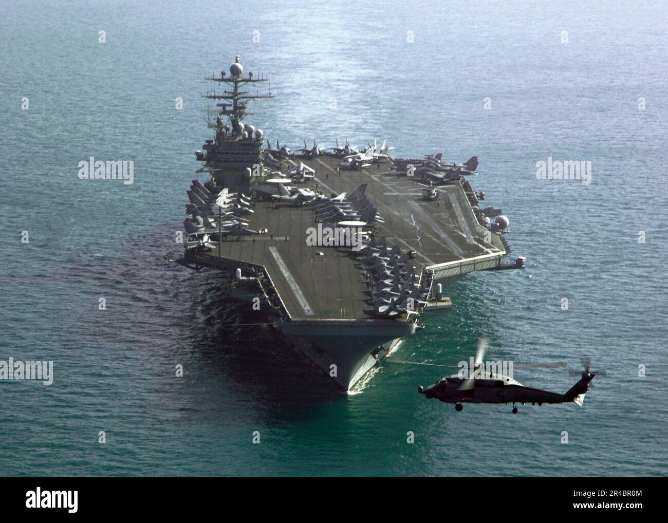 US Navy An HH-60H Seahawk helicopter hovers near the bow of the Nimitz ...
