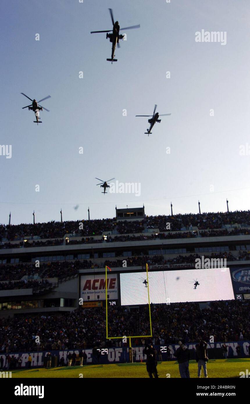 US Navy Army Cobra attack helicopters conduct a fly-over during opening ...