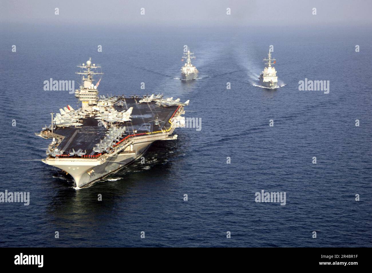 US Navy The Nimitz-class aircraft carrier USS Theodore Roosevelt (CVN 71) leads a formation ...