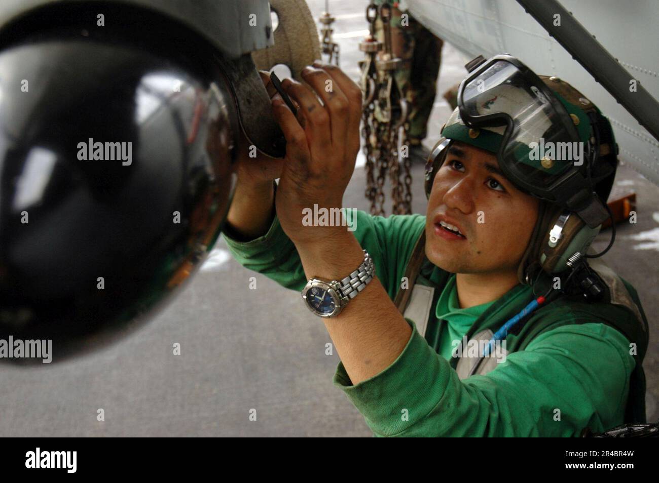 US Navy Aviation Electrician's Mate Airman examines a magnetic anomaly ...