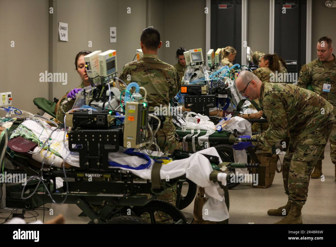 U.S. Air Force critical care air transport teams (CCATTs) assess ...