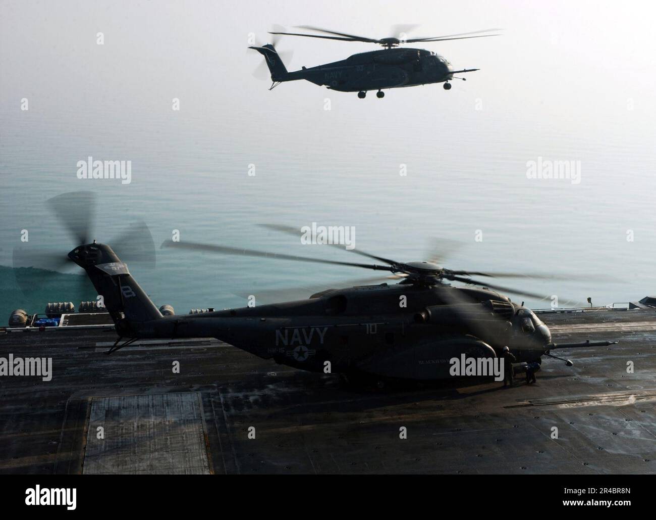 US Navy A pair of MH-53E Sea Dragon helicopters land aboard the Nimitz ...