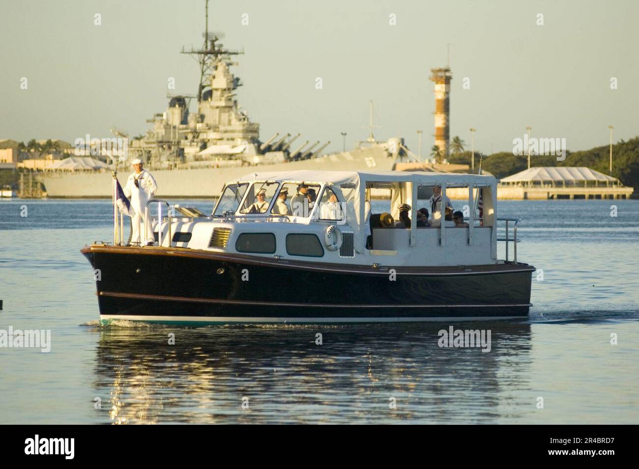 US Navy Members of the official party arrives via a captain's gig ...