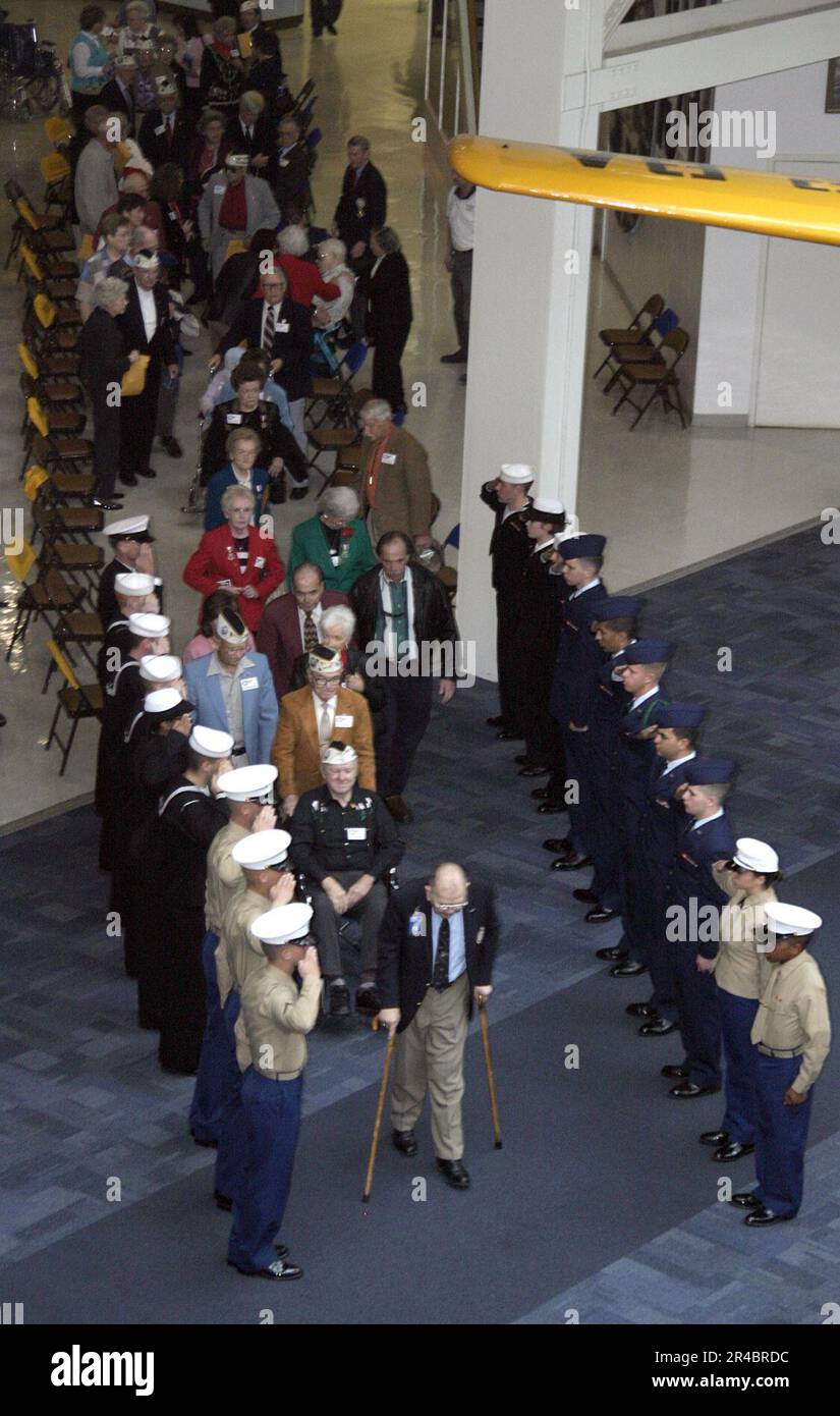 US Navy Pearl Harbor survivors make their way through sideboys from ...
