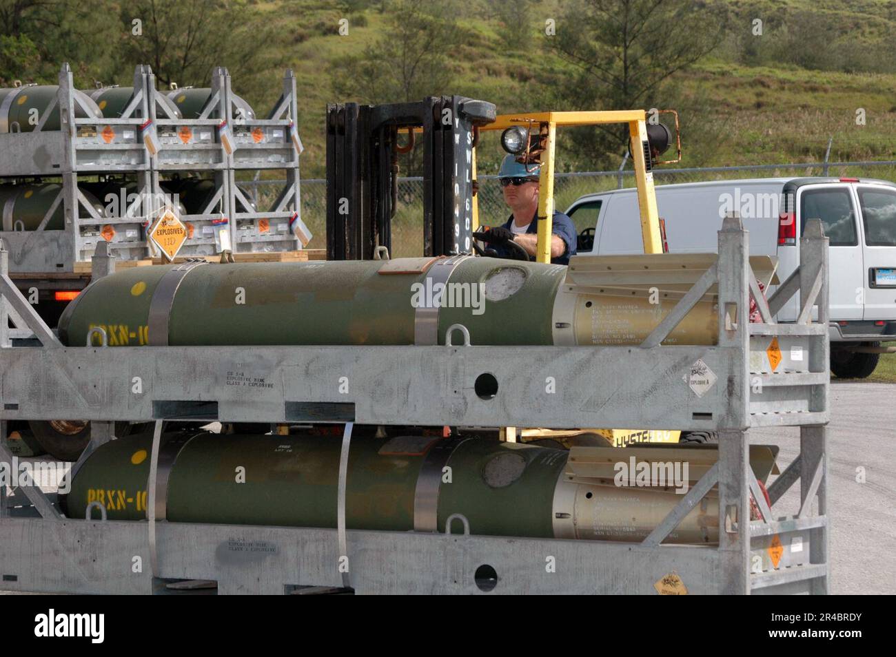 US Navy Mineman 1st Class carefully moves mines from a truck to the ...