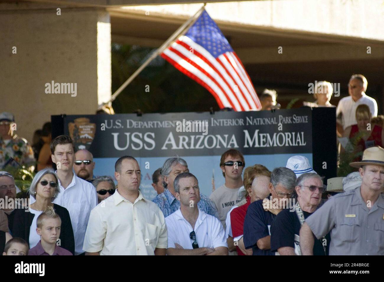 US Navy People gather to watch the 64th commemoration of the Dec. 7 ...