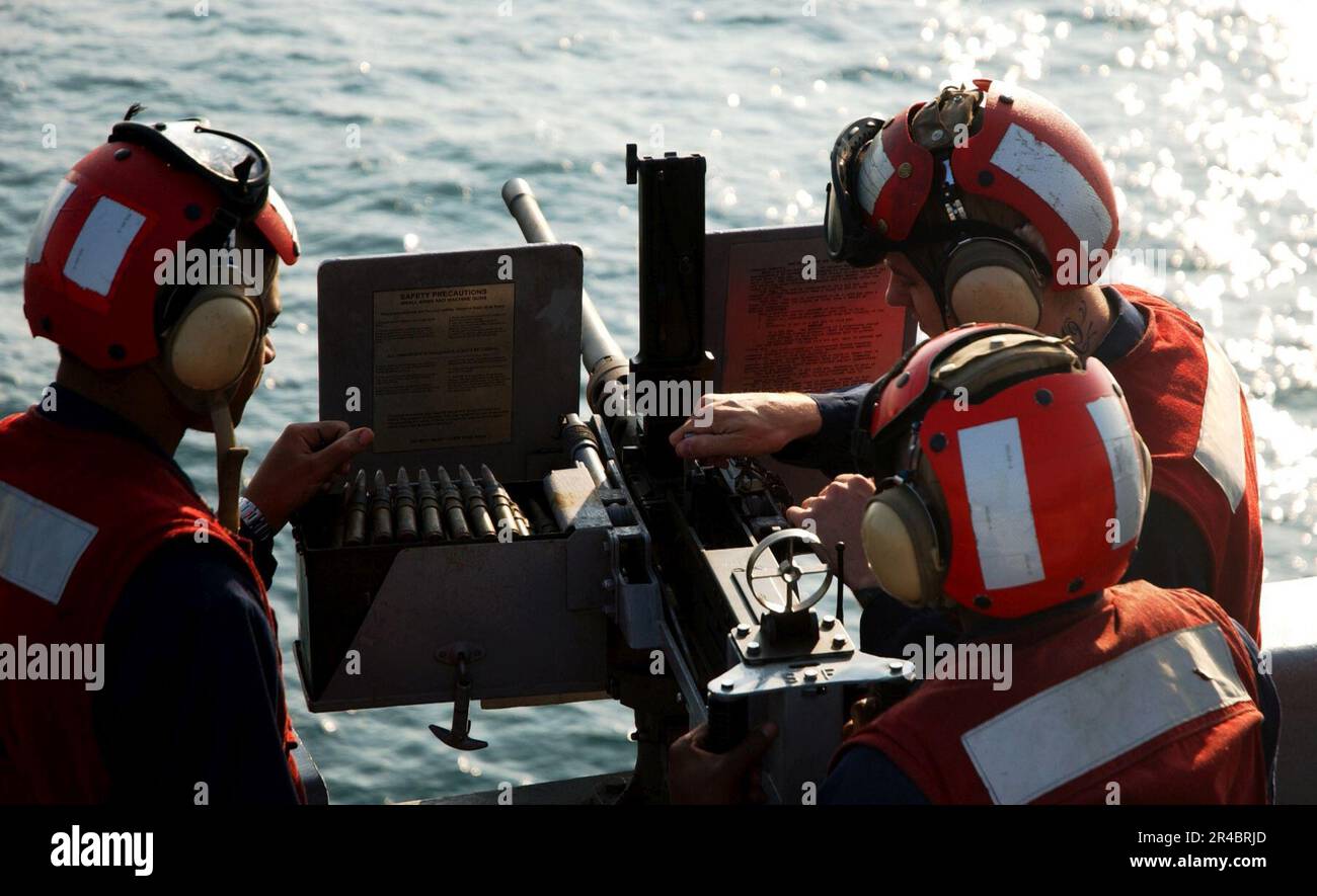 US Navy Sailors perform timing and spacing inspections, while standing ...