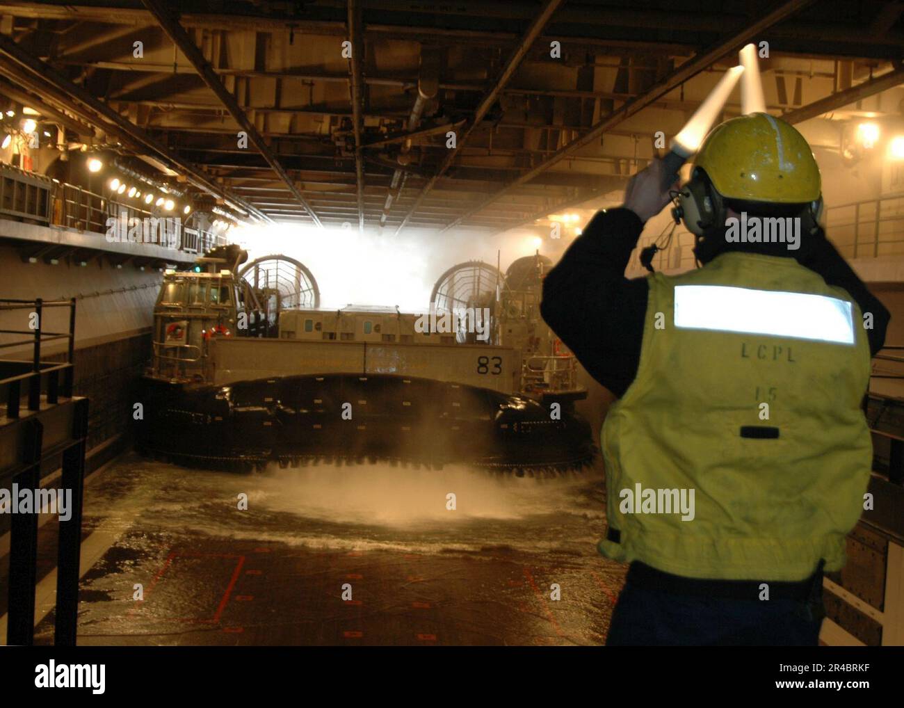 US Navy A Landing Craft Air Cushion (LCAC) enters the stern gate aboard ...