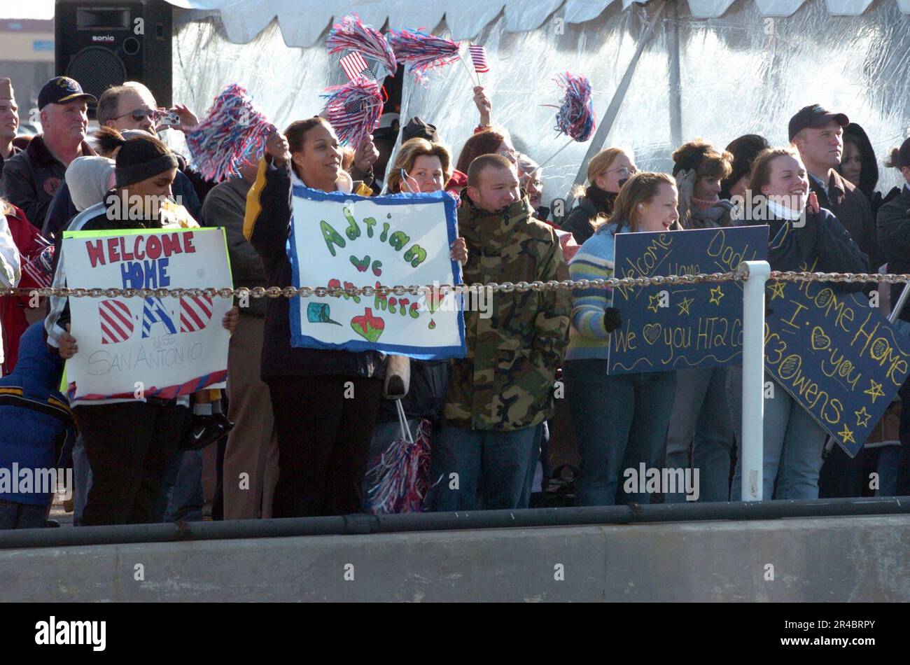 US Navy Family members anxiously await the arrival of their Sailors ...