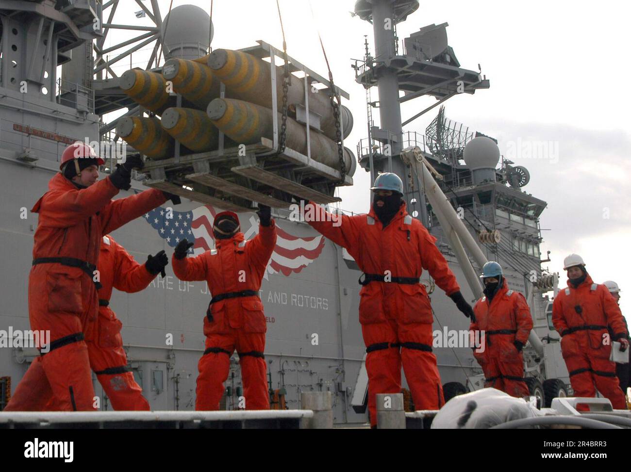 US Navy Aviation Ordnancemen carefully inventory ordnance aboard the ...