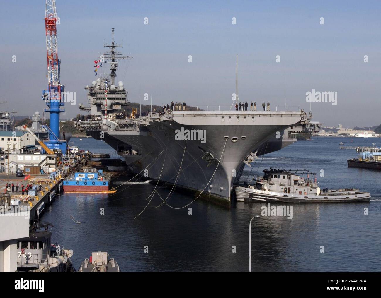 Us Navy The Conventionally Powered Aircraft Carrier Uss Kitty Hawk Cv 63 Moors Along The Pier