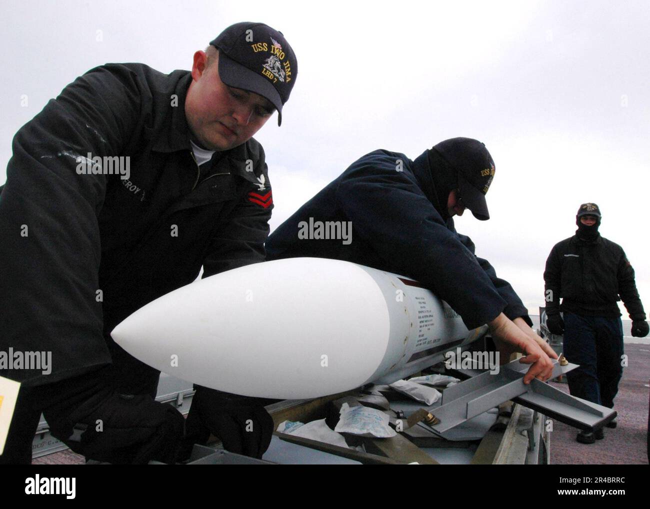 US Navy Fire Controlman 2nd Class takes inventory of a RIM-7 NATO Sea ...