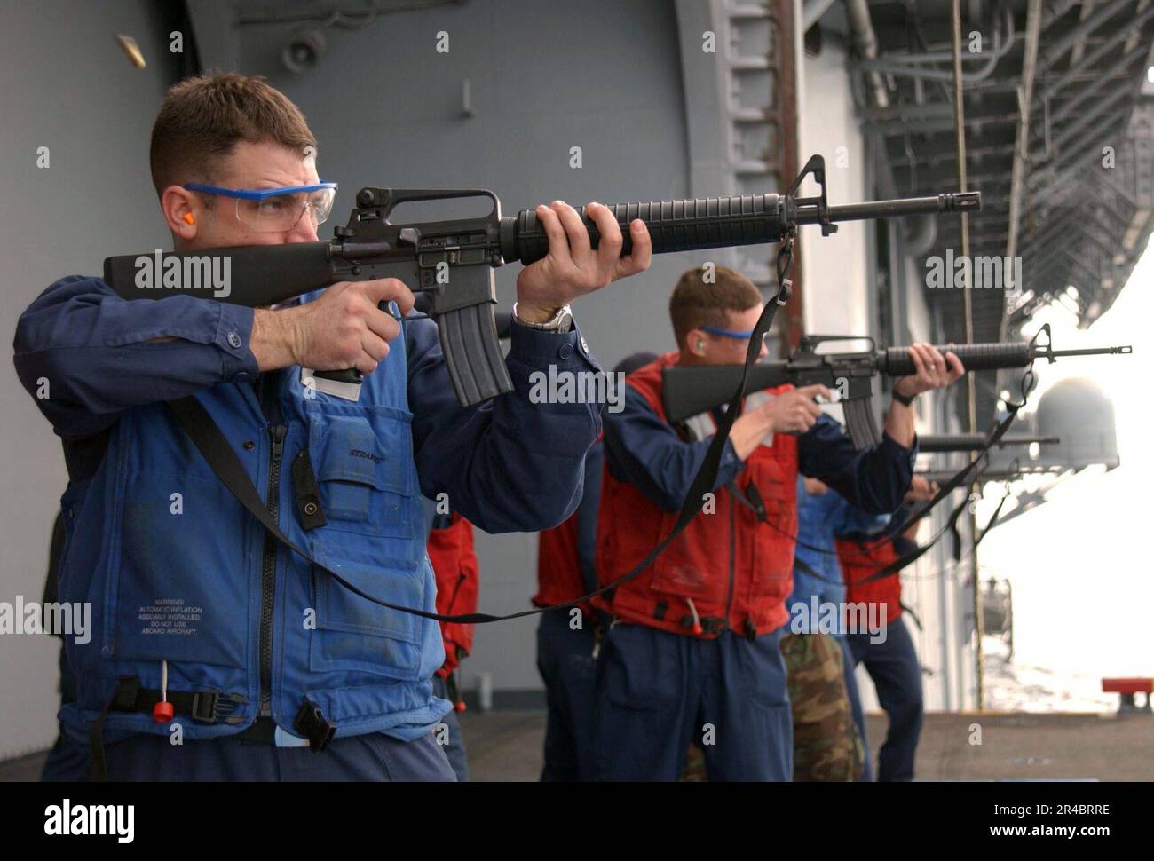 US Navy Culinary Specialist 2nd Class fires an M-16 semi-automatic ...