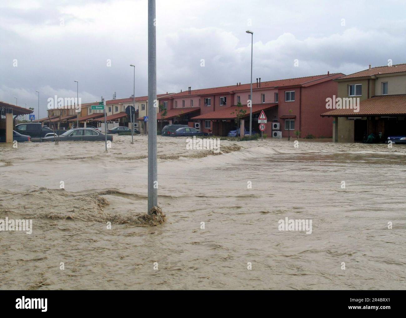 US Navy Flood waters flow through the main streets at the U.S. Navy ...