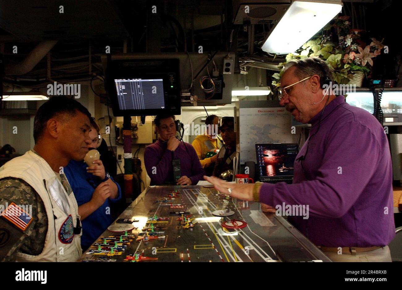 US Navy Aircraft Handling Officer Lt. Cmdr. right, explains the basic ...