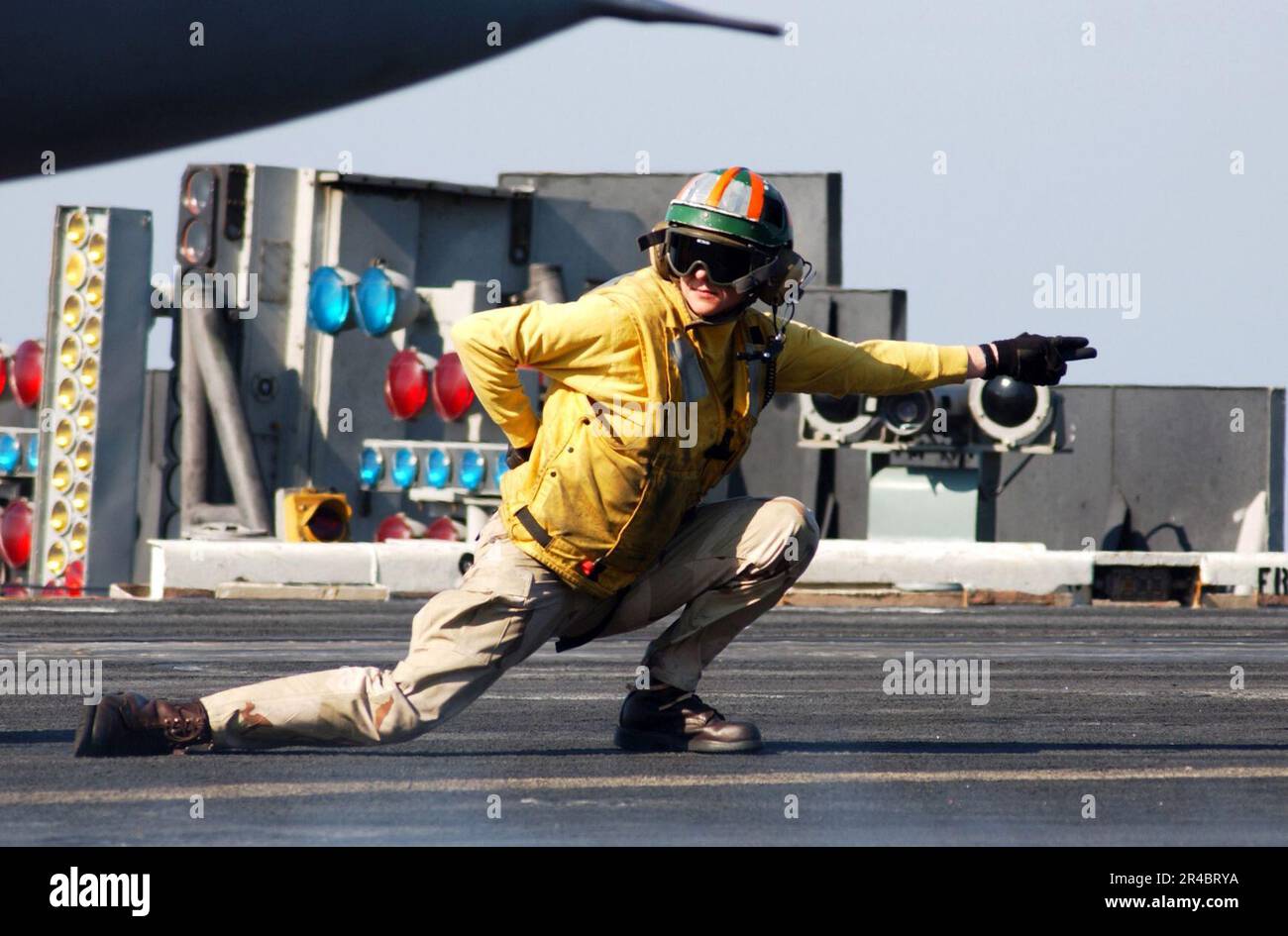 US Navy Lt. Cmdr. gives the signal to launch an F-14D Tomcat on the ...