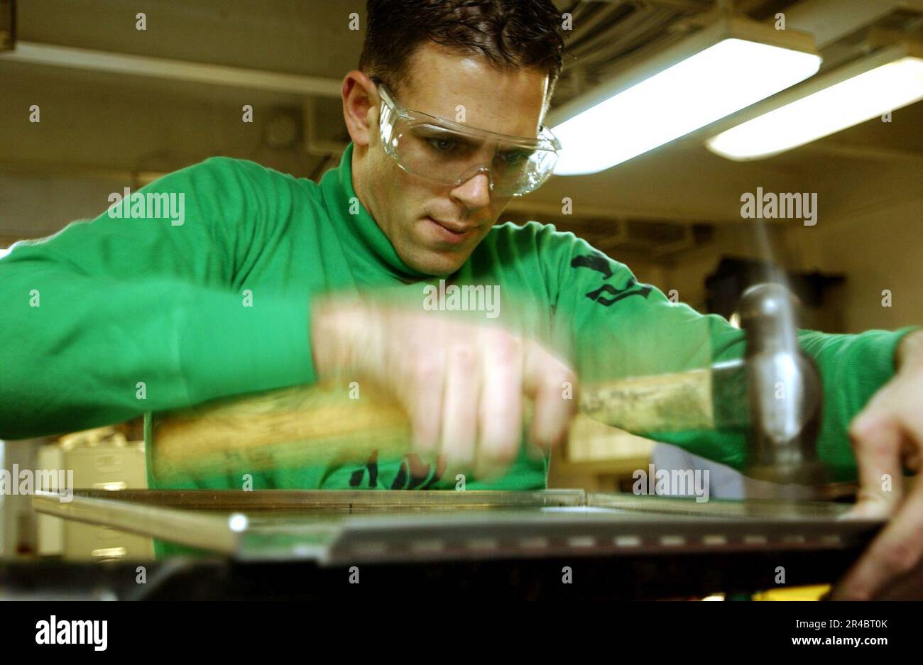 US Navy Aviation Structural Mechanic 2nd Class constructs a steel box ...