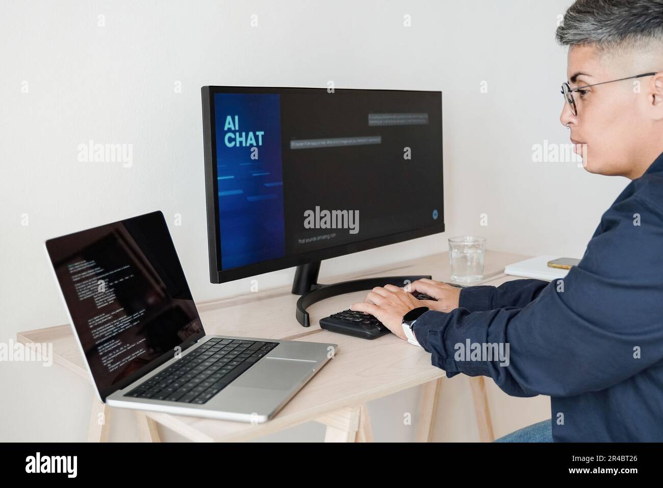 AI chatbot: Programmer using artificial intelligence for software development inside office ...