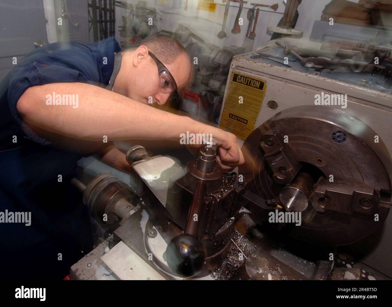 US Navy Machinery Repairman 2nd Class turns a Hossfeld pipe bender ...