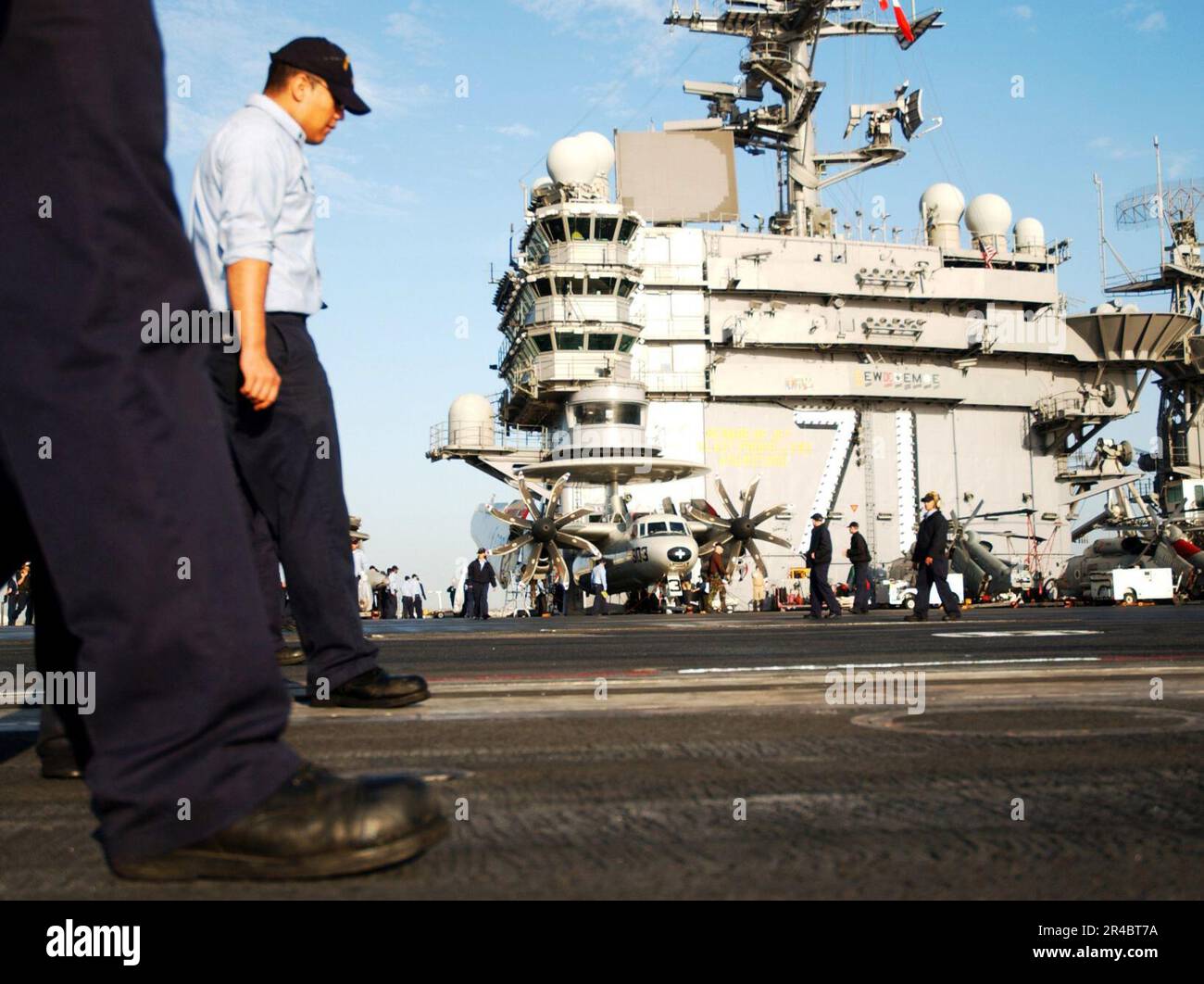 US Navy Flight deck crewmembers participate in a Foreign Object Debris ...