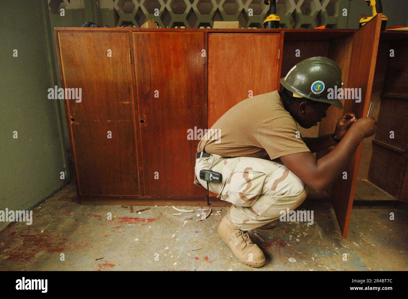 US Navy Store Keeper 2nd Class a U.S. Navy Seabee assigned to Naval ...
