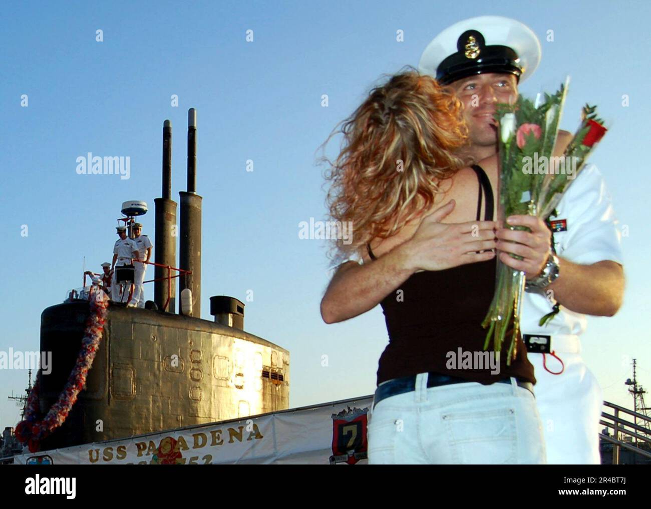 US Navy A chief petty officer embraces a family member after the ...