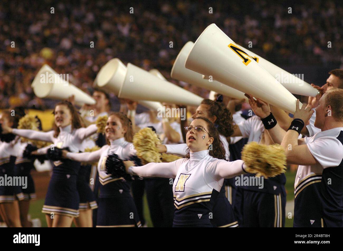 US Navy U.S. Naval Academy Midshipmen cheerleaders show team spirit ...