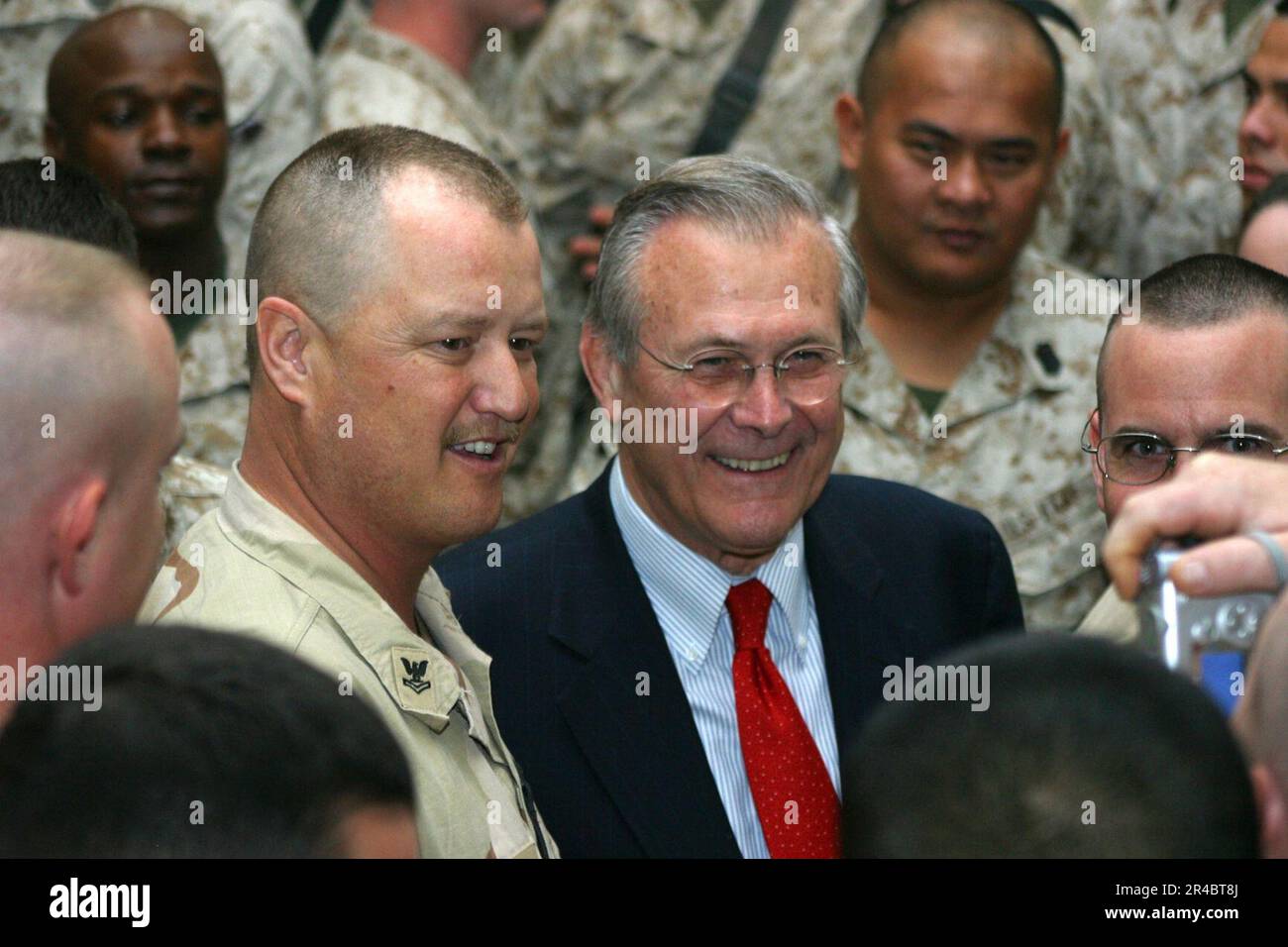 US Navy Secretary of Defense Donald Rumsfeld greets and takes photos ...