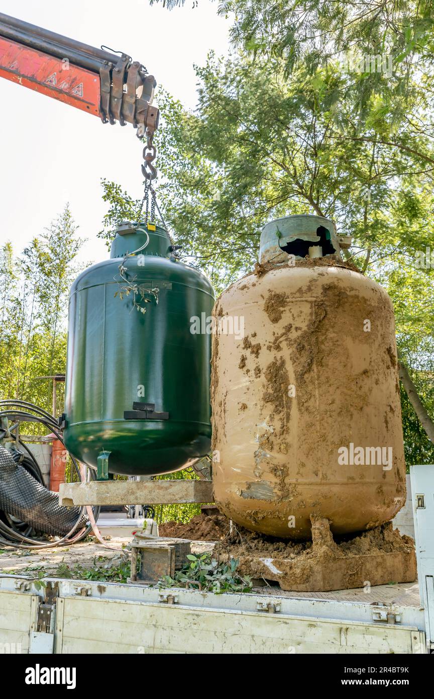 Replacing an old LPG tank with a new one that is about to be buried ...