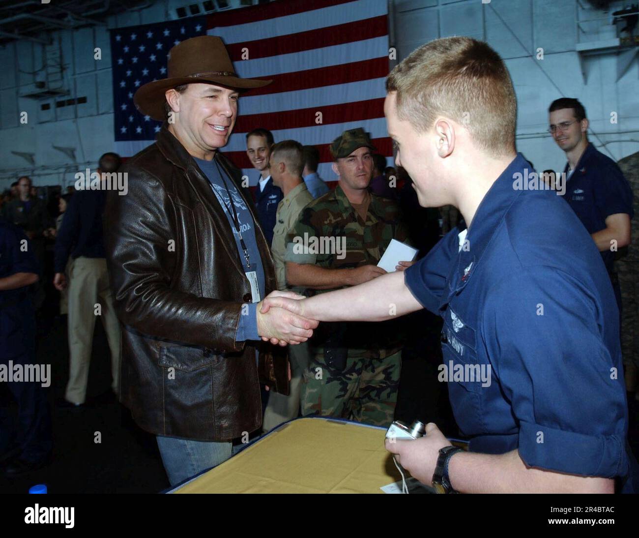 US Navy Country Music Singer Michael Peterson shakes hands with a crew ...