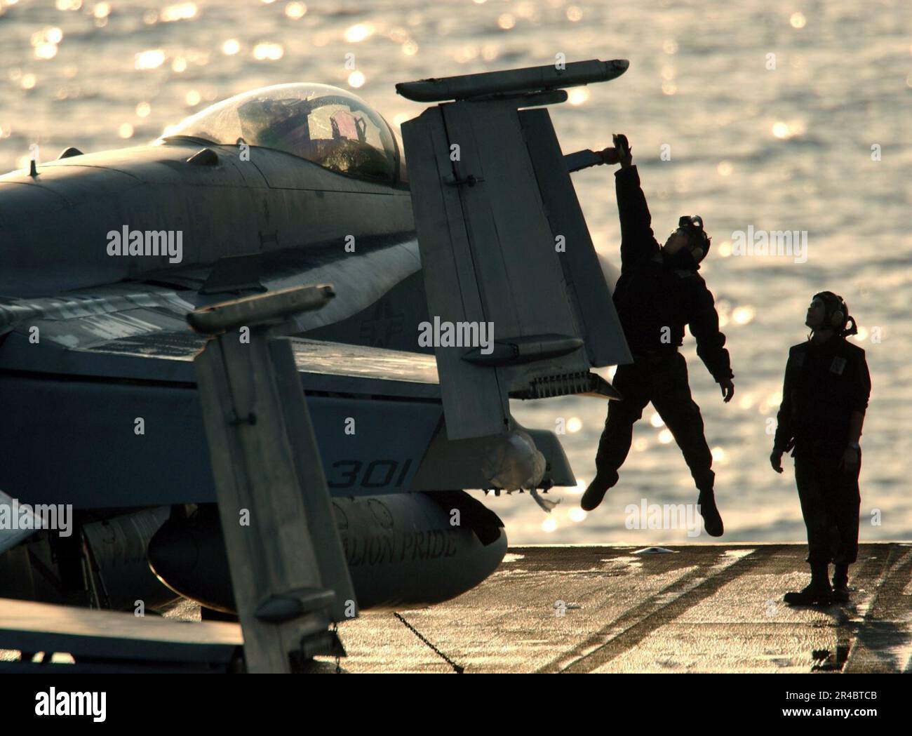 US Navy A Sailor assigned to the Valions of Strike Fighter Squadron One ...