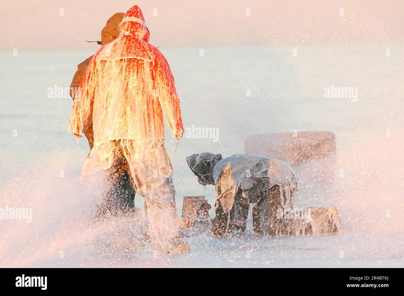 US Navy Damage Controlman Fireman collects samples of Aqueous Film ...