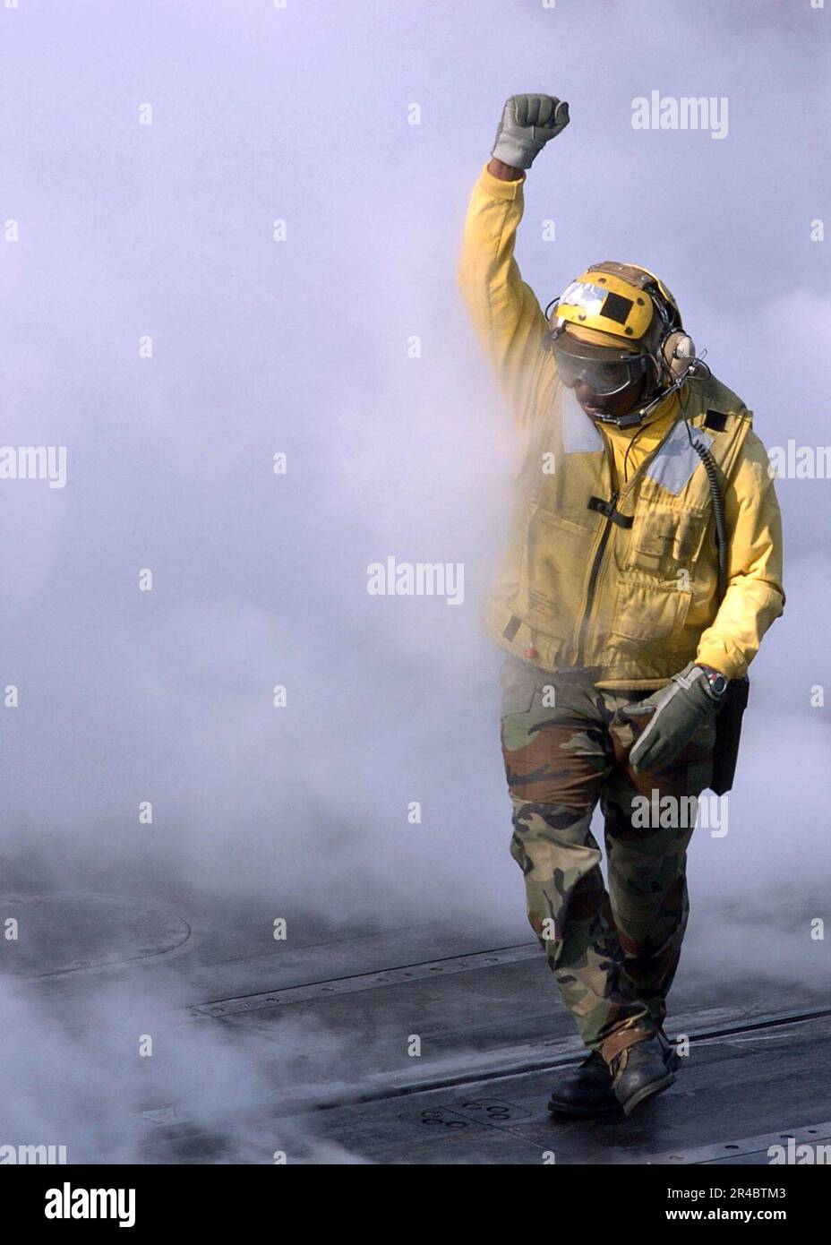 US Navy Aviation Boatswain Mate Handler 2nd Class spots the catapult ...