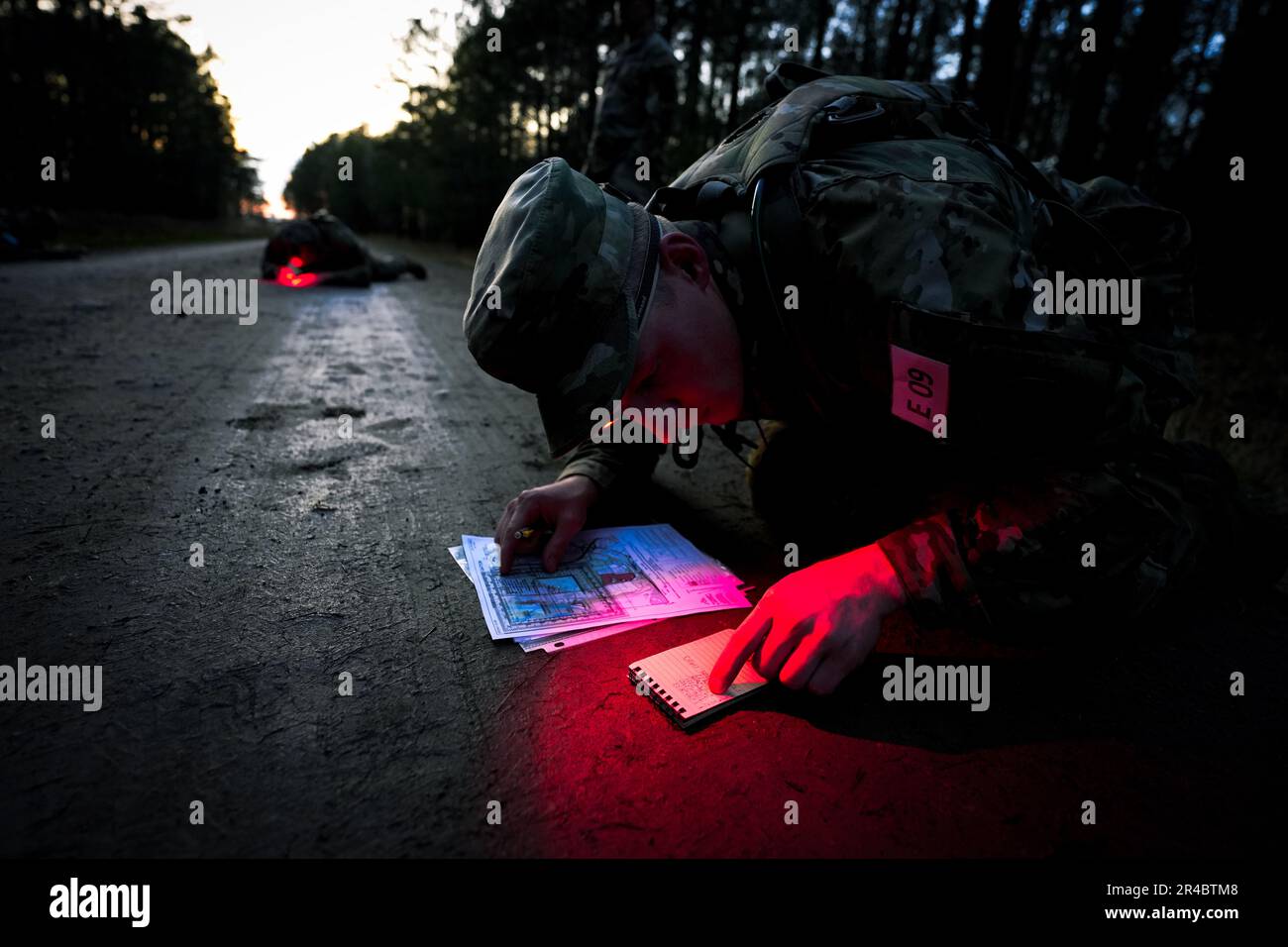 Soldiers plot coordinates in preparation to complete the night land ...