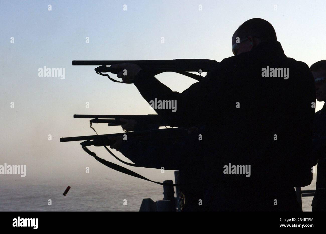 US Navy Sailors perform shotgun training on the fantail aboard the ...