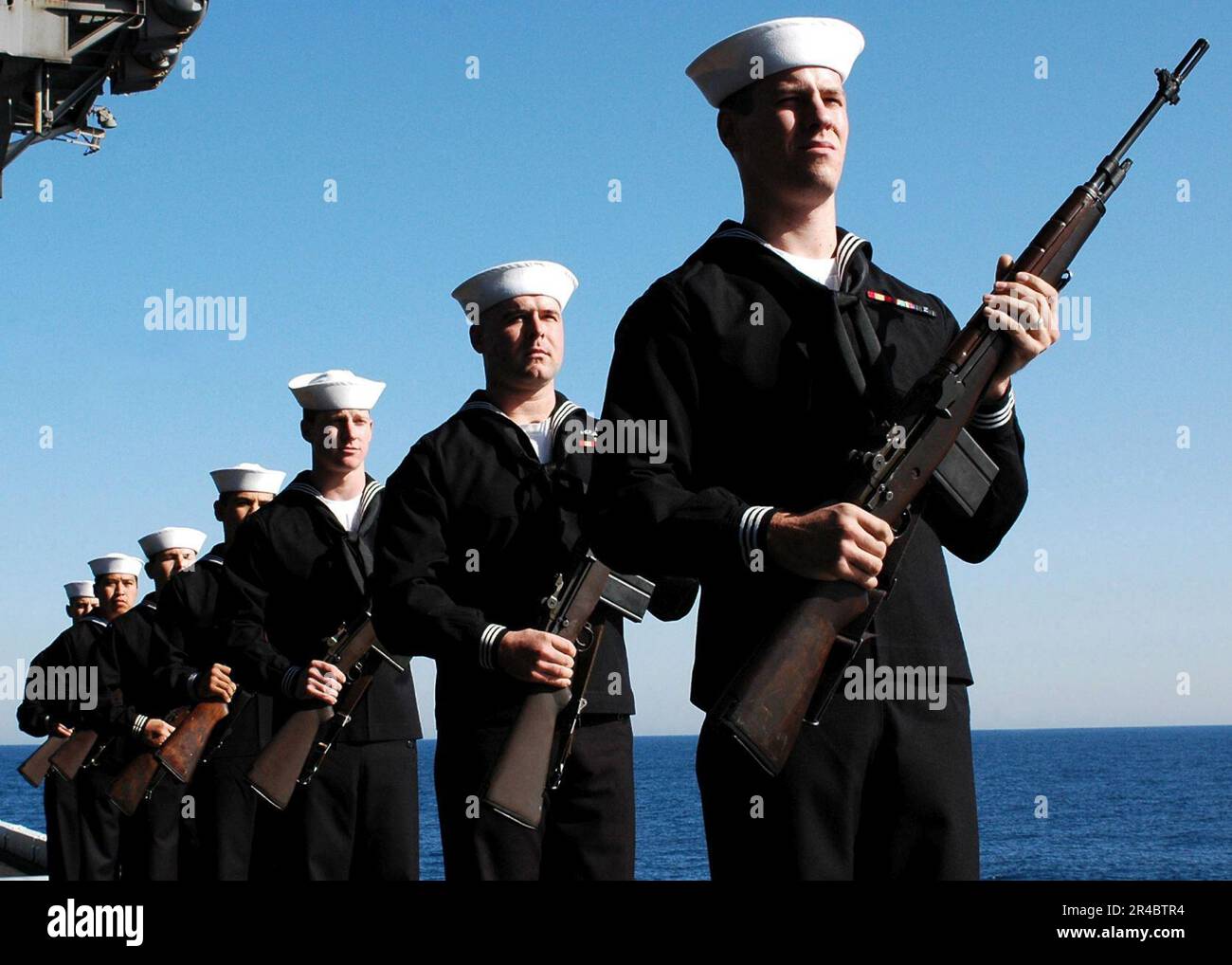 US Navy Members of the rifle team participate in a burial at sea ...
